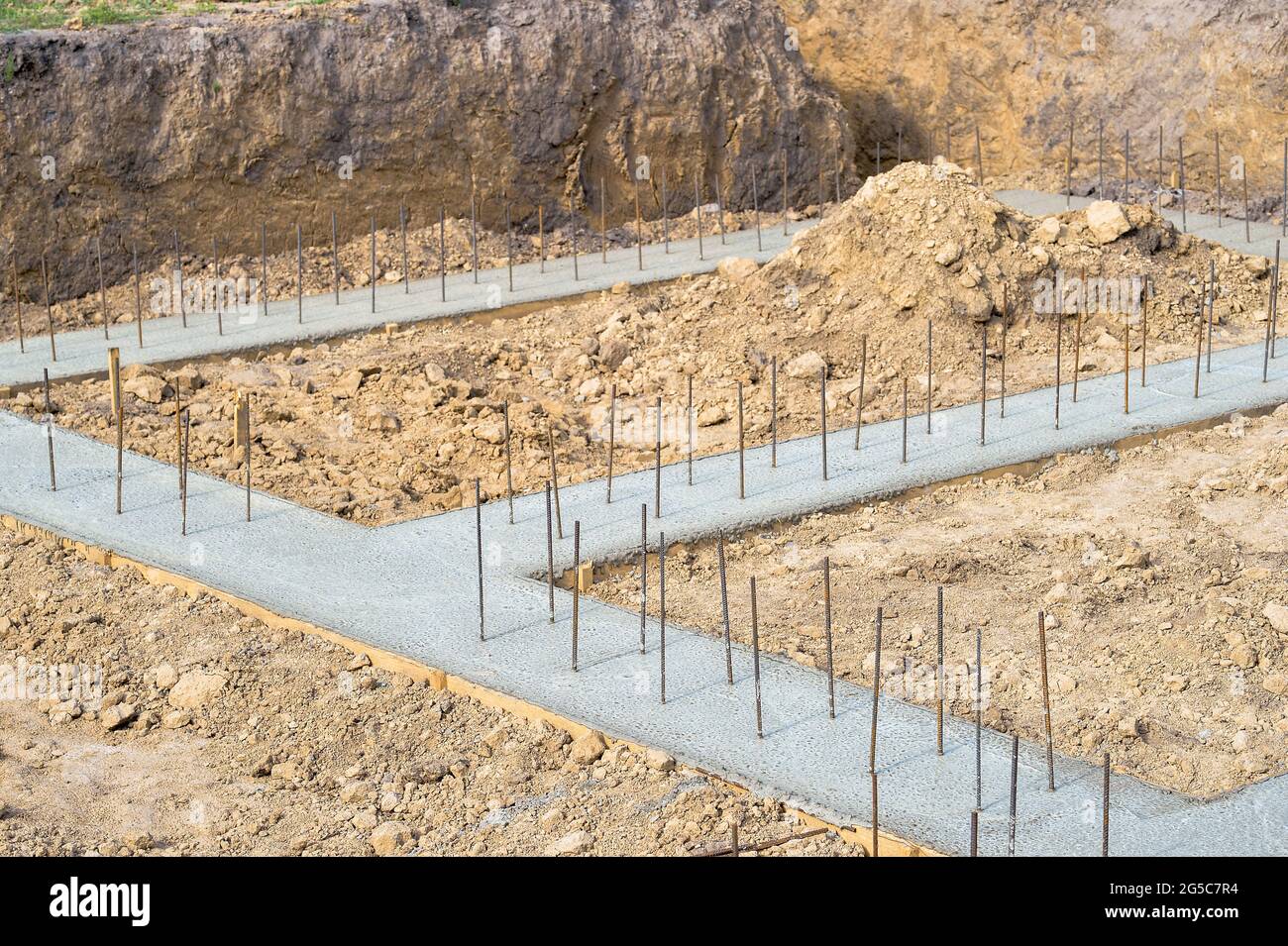 Pouring a concrete solution of the foundation of the construction of a ...