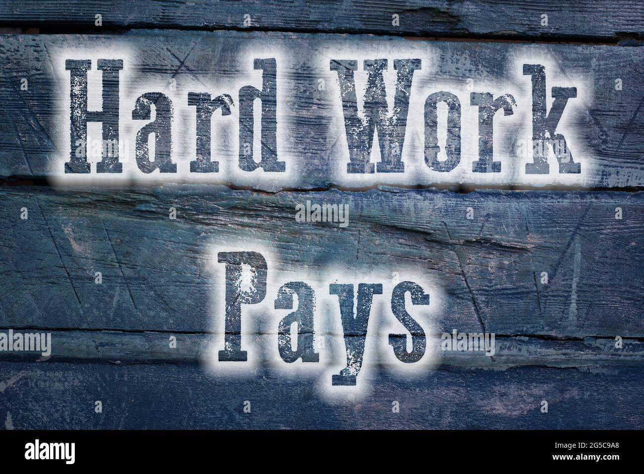 Hard work pays concept text on background Stock Photo - Alamy