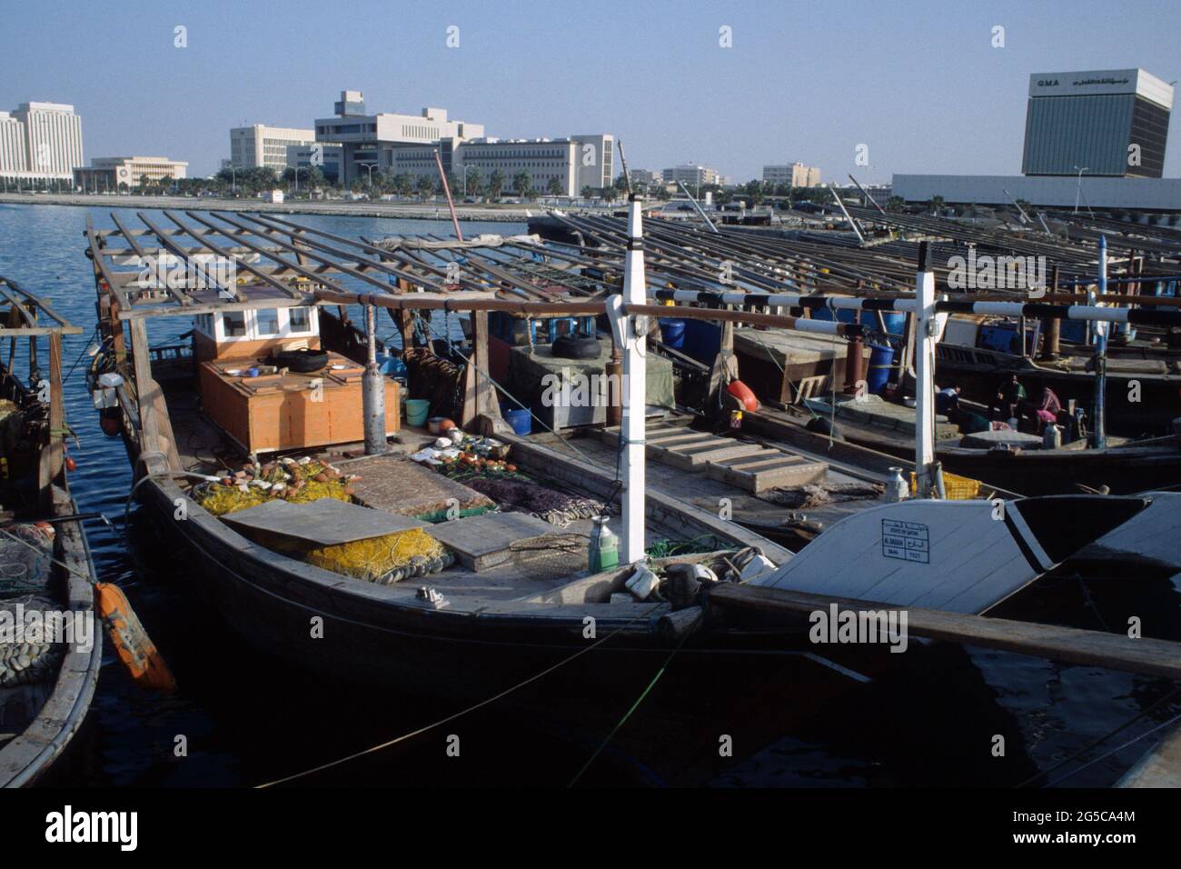 Traditional fishing dhow in the port of Doha city, state of Qatar ...