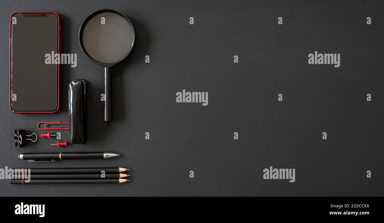 Office black workspace with office supplies and copy space on black ...