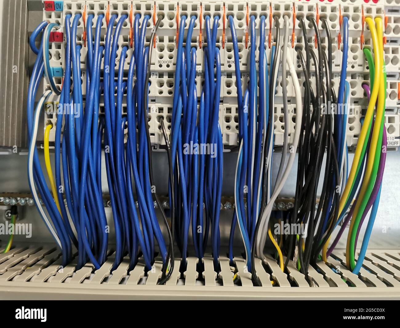 Closeup shot of blue and yellow colored wires connected with electronic ...