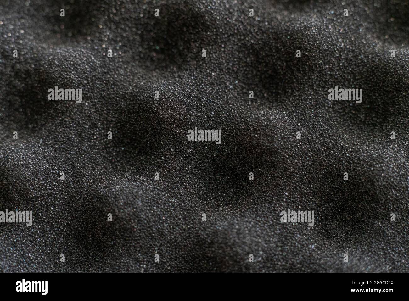 abstract dark black foam rubber texture, macro view, protection ...