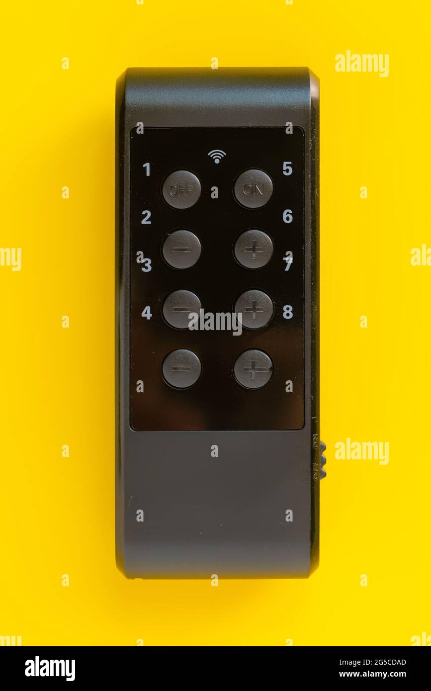 simple remote wireless controlle on color background isolated top view ...