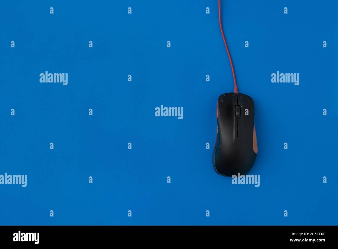 top view of the simple computer mouse on the color background with copy ...