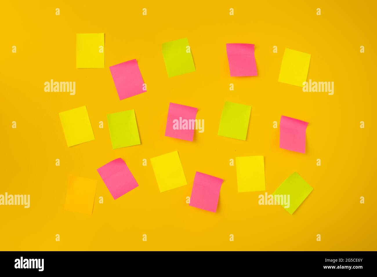 top view of some color paper stickers on the wall background, abstract ...