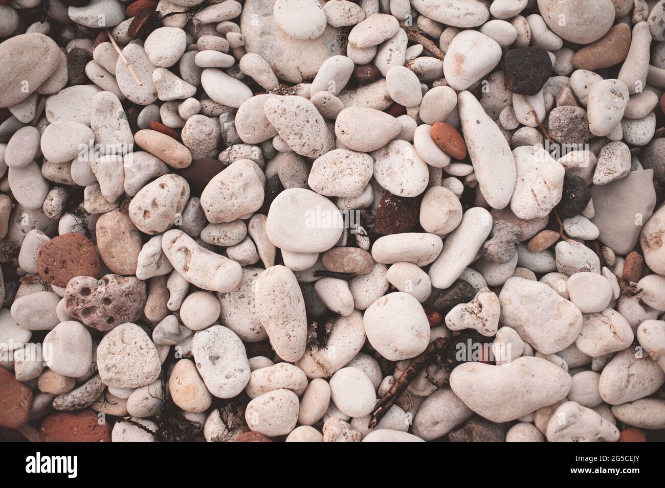 Different color beach stone pebbles at seashore outdoors top view ...