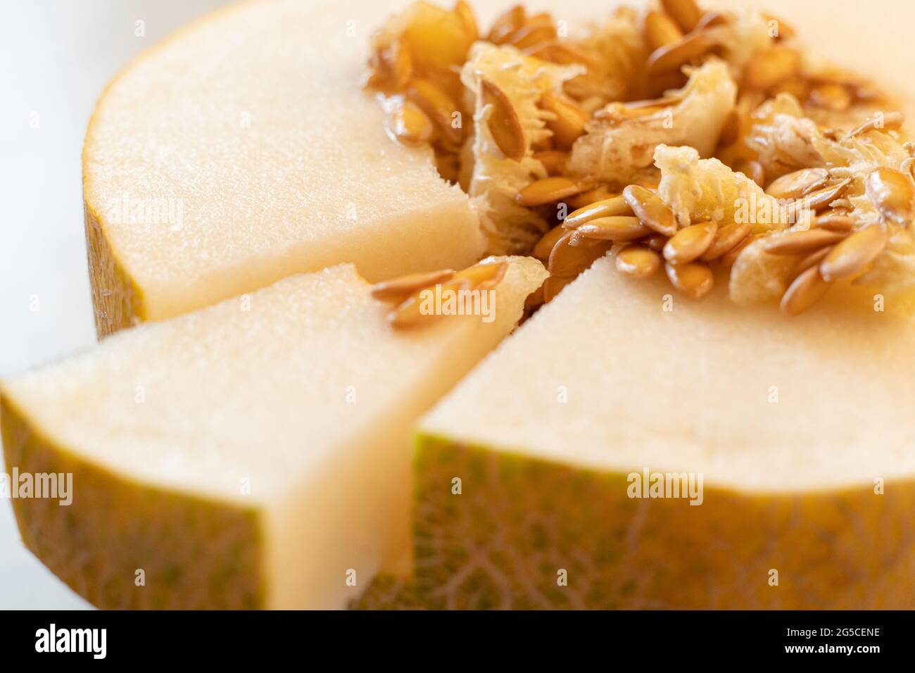 close up macro of the cut melon with seeds to get some vitamins Stock ...
