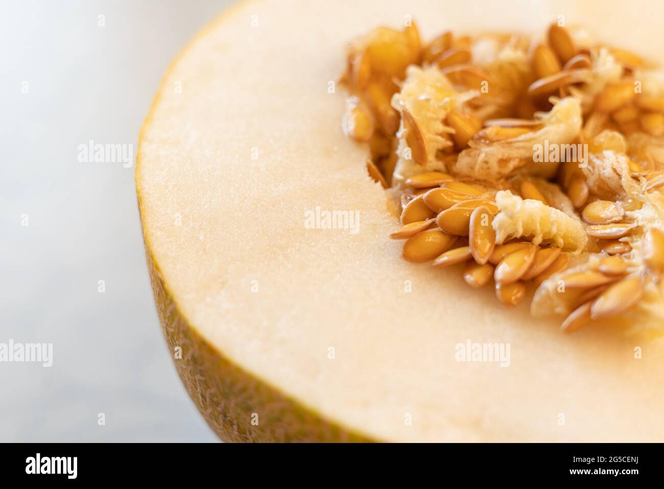 close up macro of the cut melon with seeds to get some vitamins Stock ...