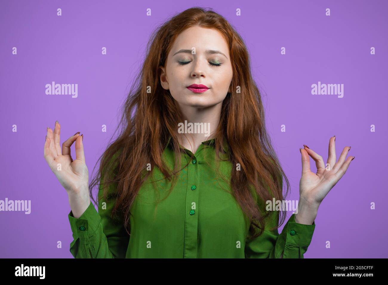 Calm woman relaxing, meditating. She calms down, breathes deeply with ...