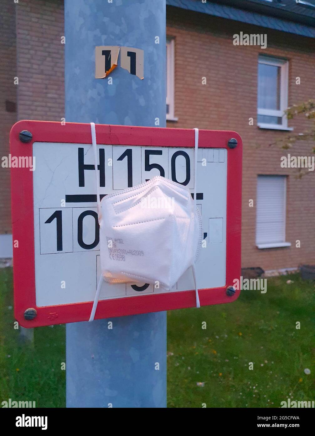 Masked sign - a picture for the pandemic Stock Photo - Alamy