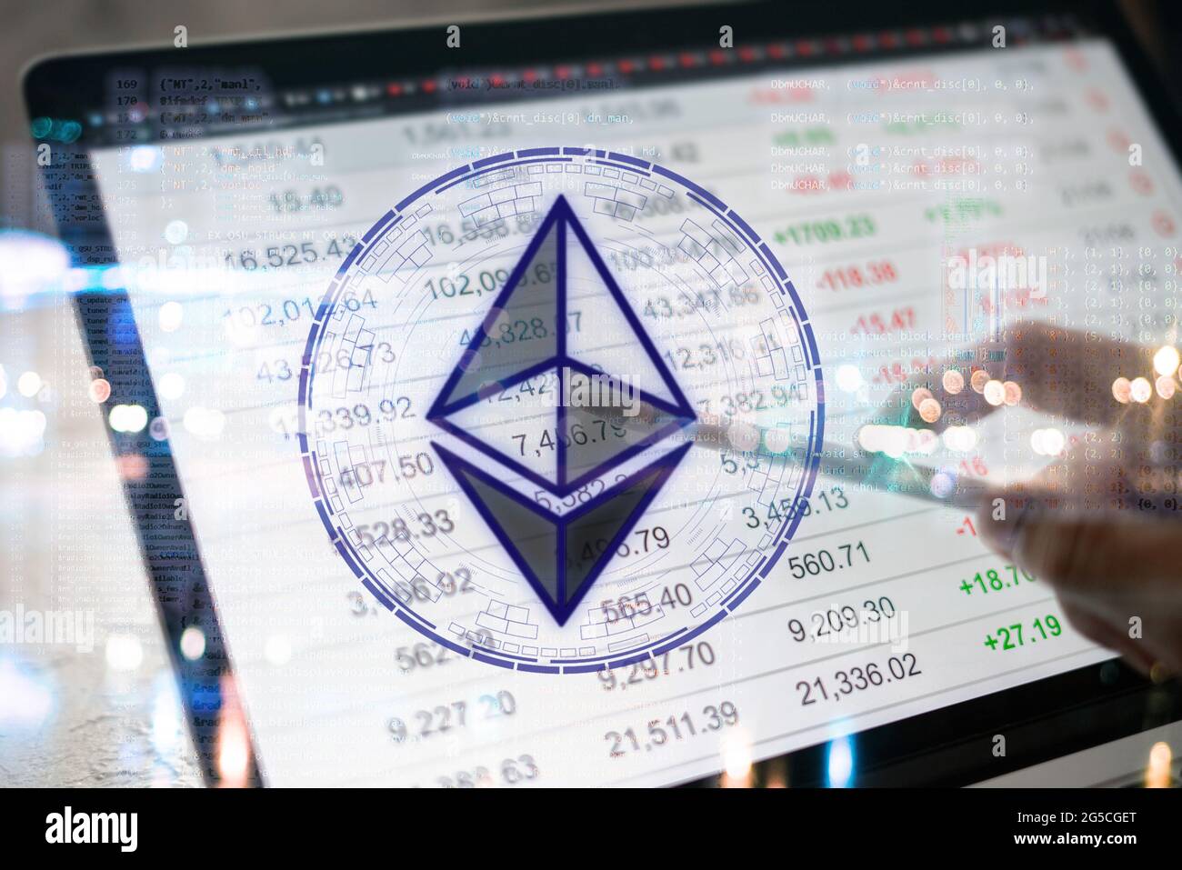 crypto currency etherium symbol while using computer laptop background ...