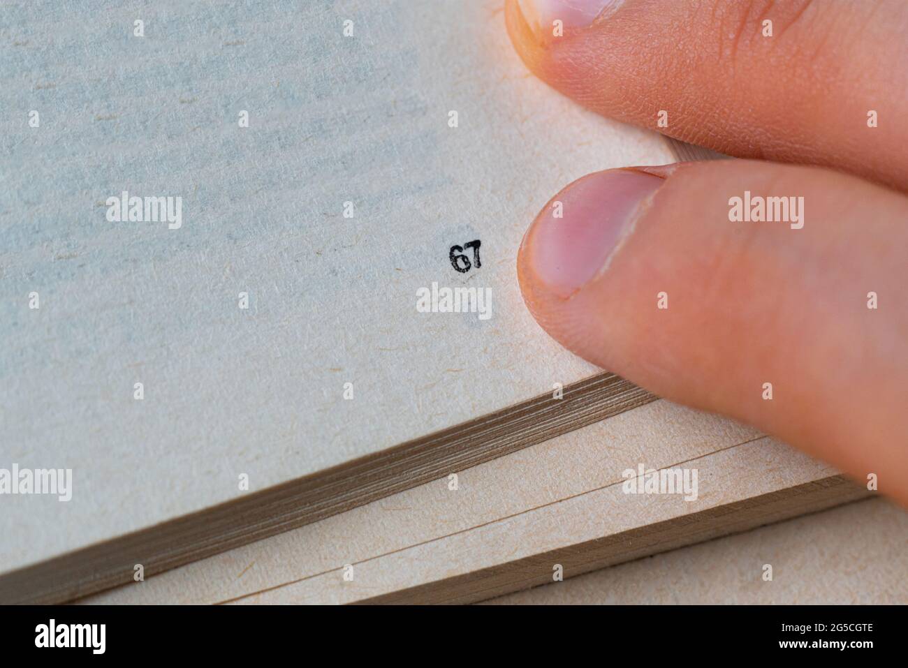 close up macro shot of person hand fingers turn the book page Stock ...