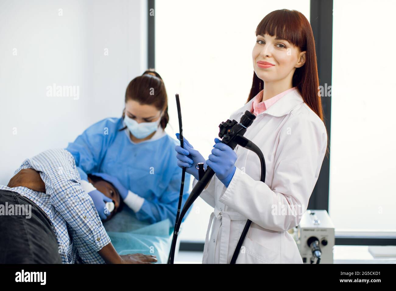 Endoscopy concept. Portrait of young Caucasian woman doctor holding ...