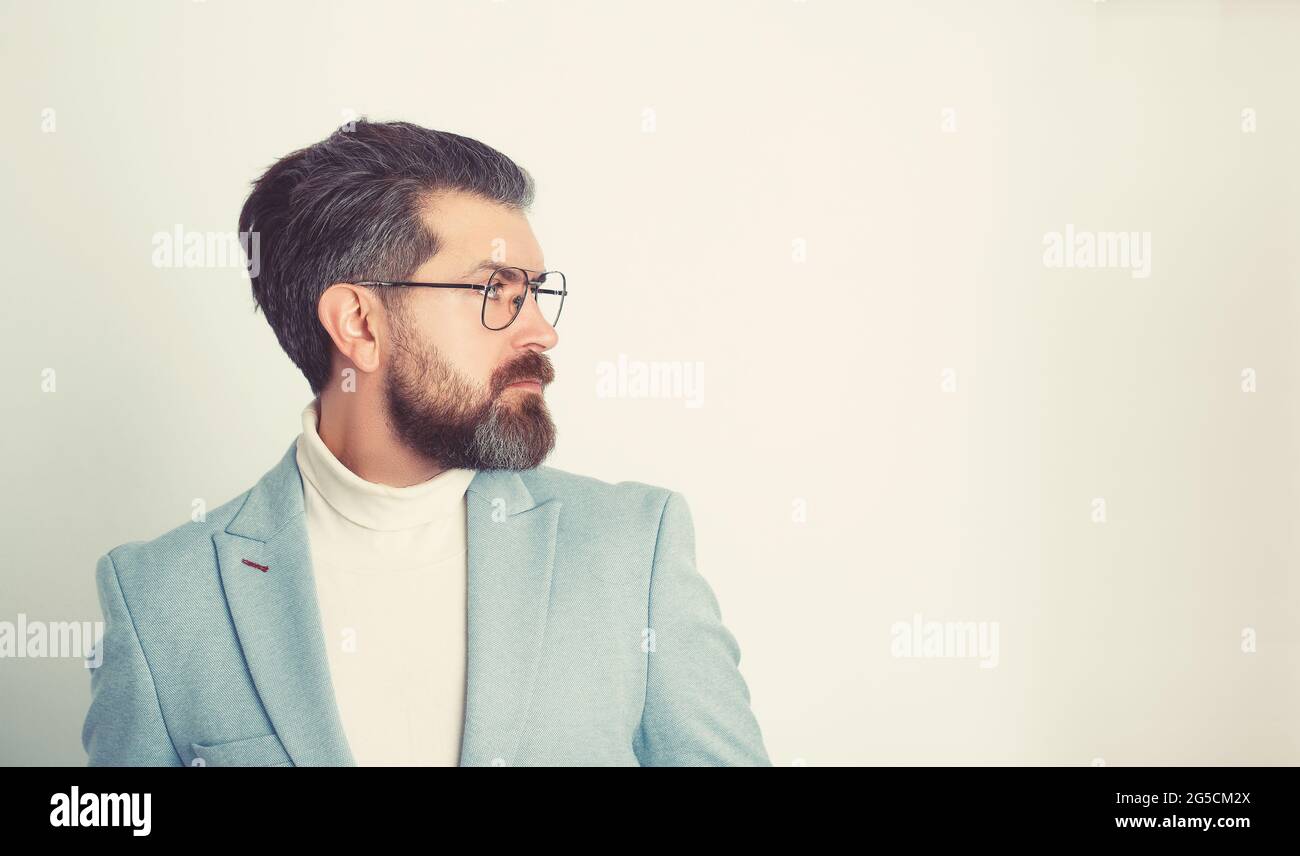 Side view portrait of serious fashionable handsome man in blue suit ...