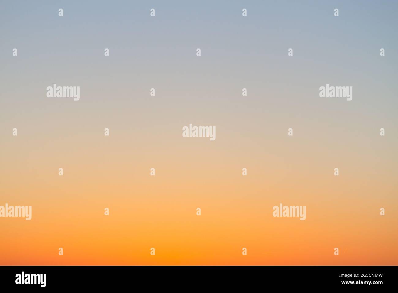 Sky gradient from blue to orange sunrise Stock Photo - Alamy