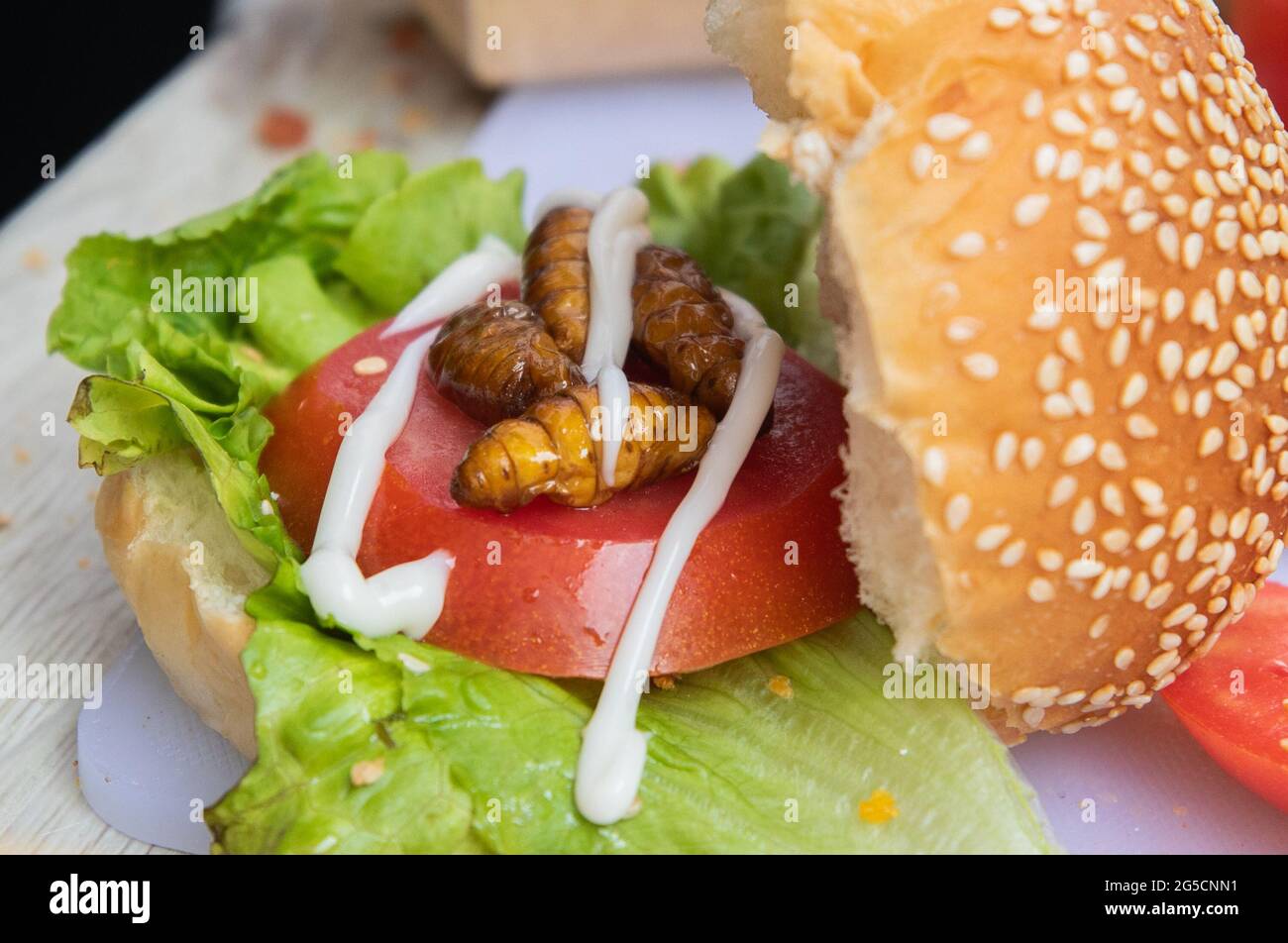 Wuhan, China. 26th June, 2021. College students taste food cooked with ...