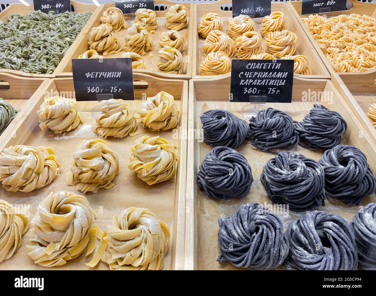 A variety of handmade spaghetti is sold by weight on footcourt. In ...