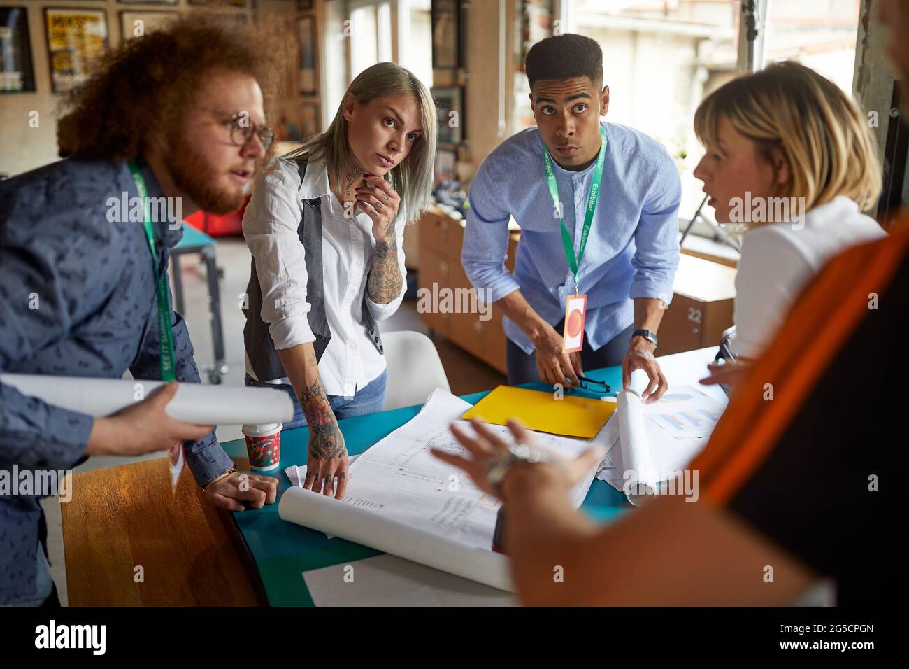 A group of young creative colleagues in a working atmosphere in the ...