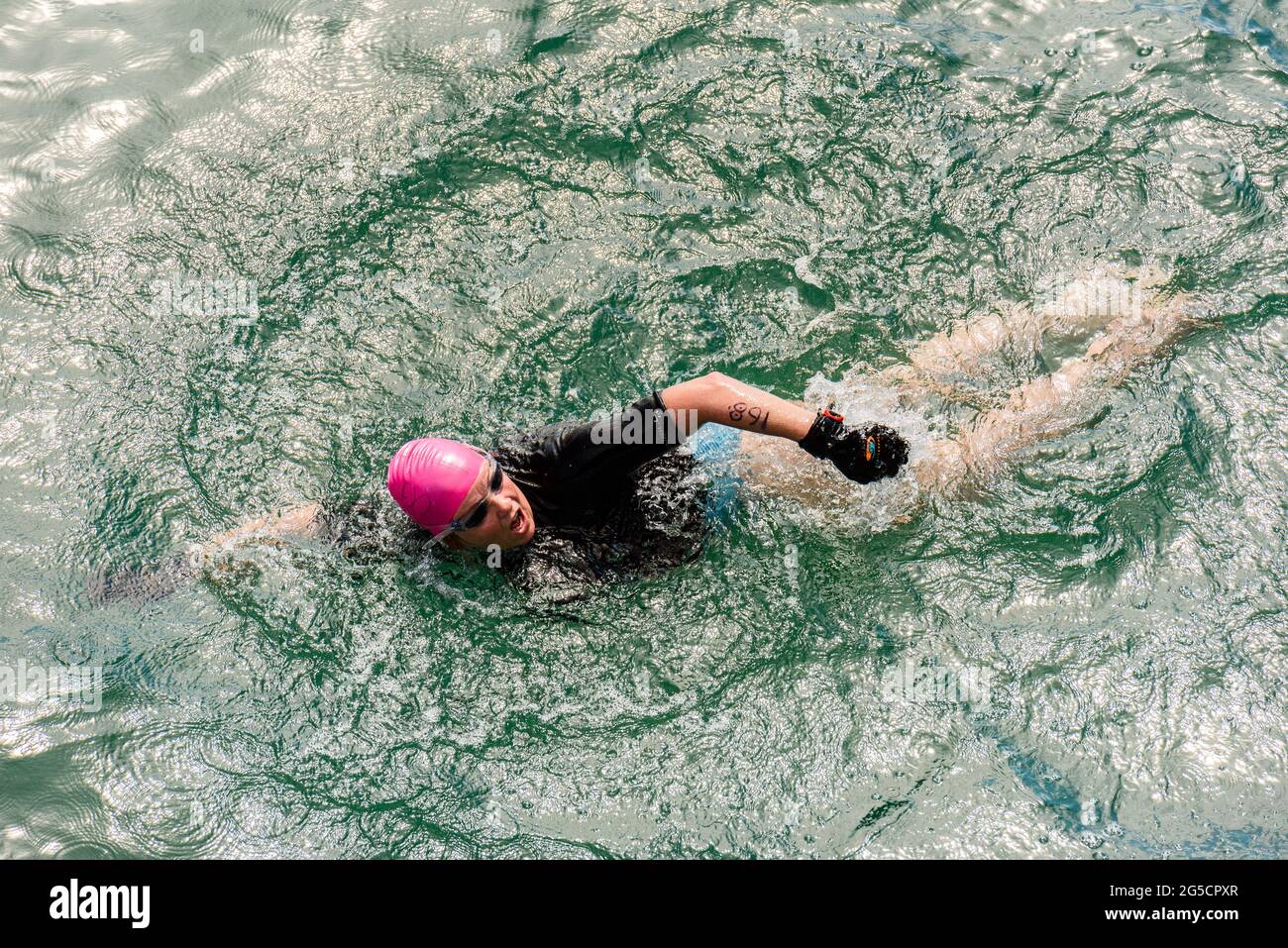 Brighton, UK. June 26th 2021 A swimmer crosses the finish line under ...