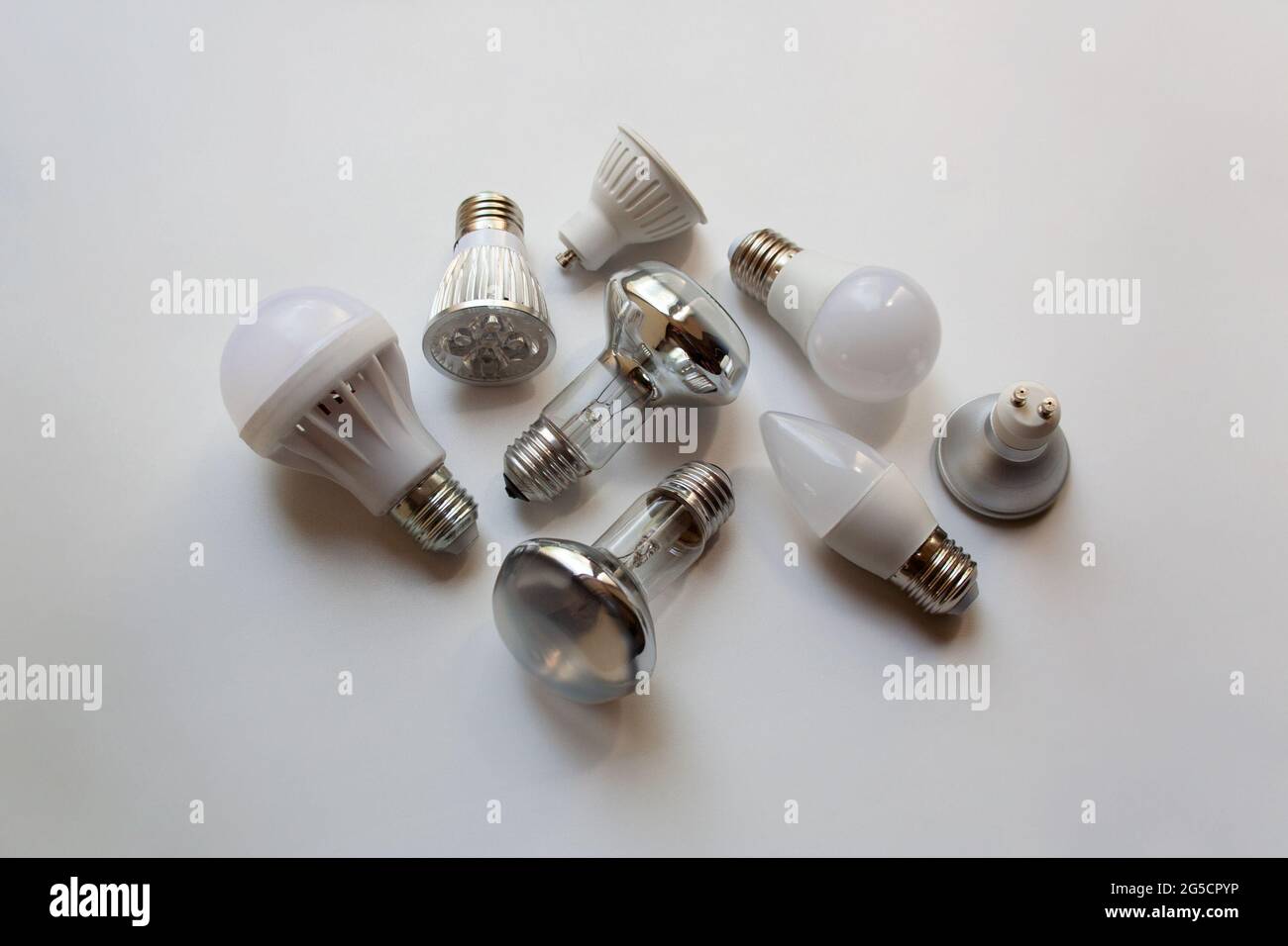 Electric lamps of various type, shape and base isolated on white ...