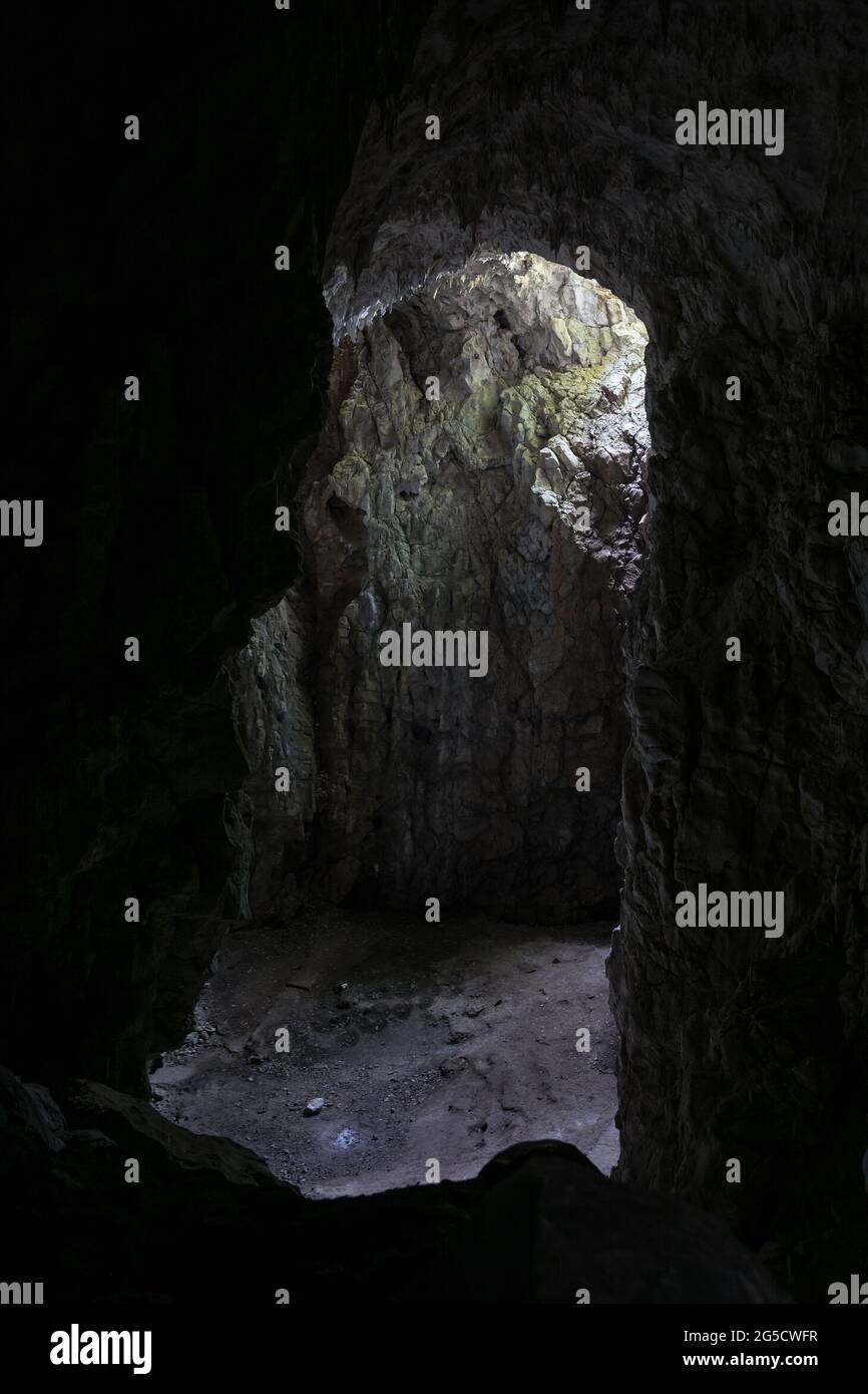Mysterious view of the entrance to the light soucre in a cave Stock ...