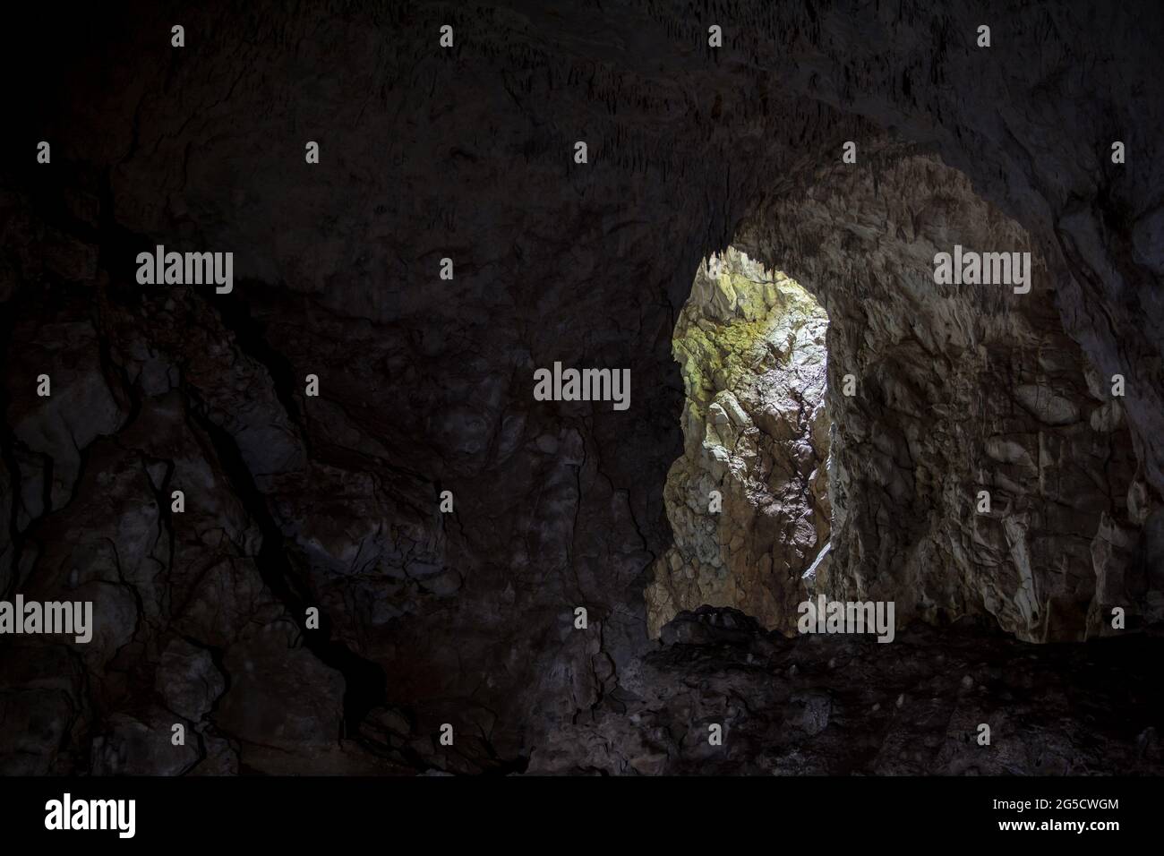 Mysterious view of the entrance to the light soucre in a cave Stock ...