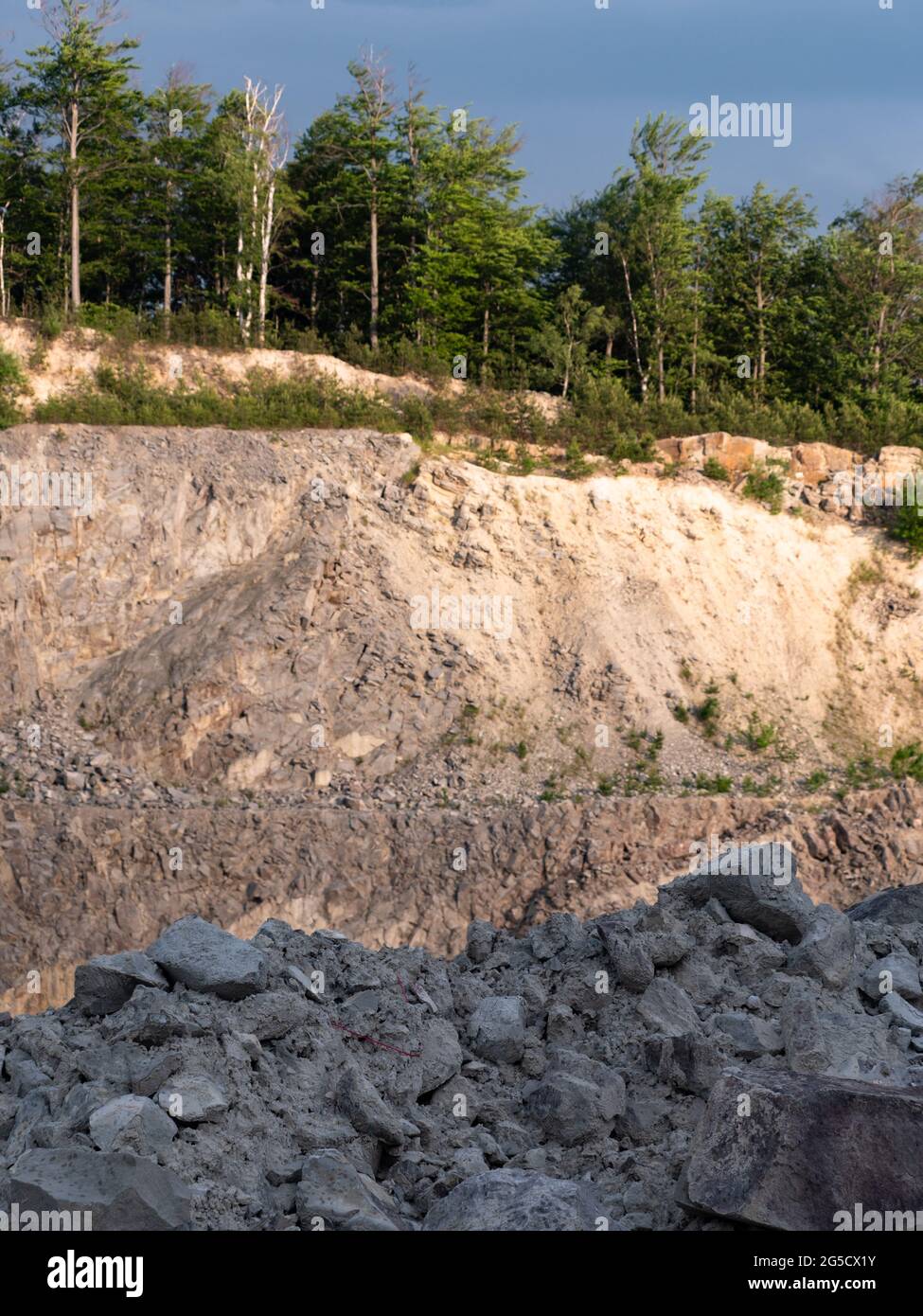 Quarry materials for the construction industry. Granite mine with deep ...