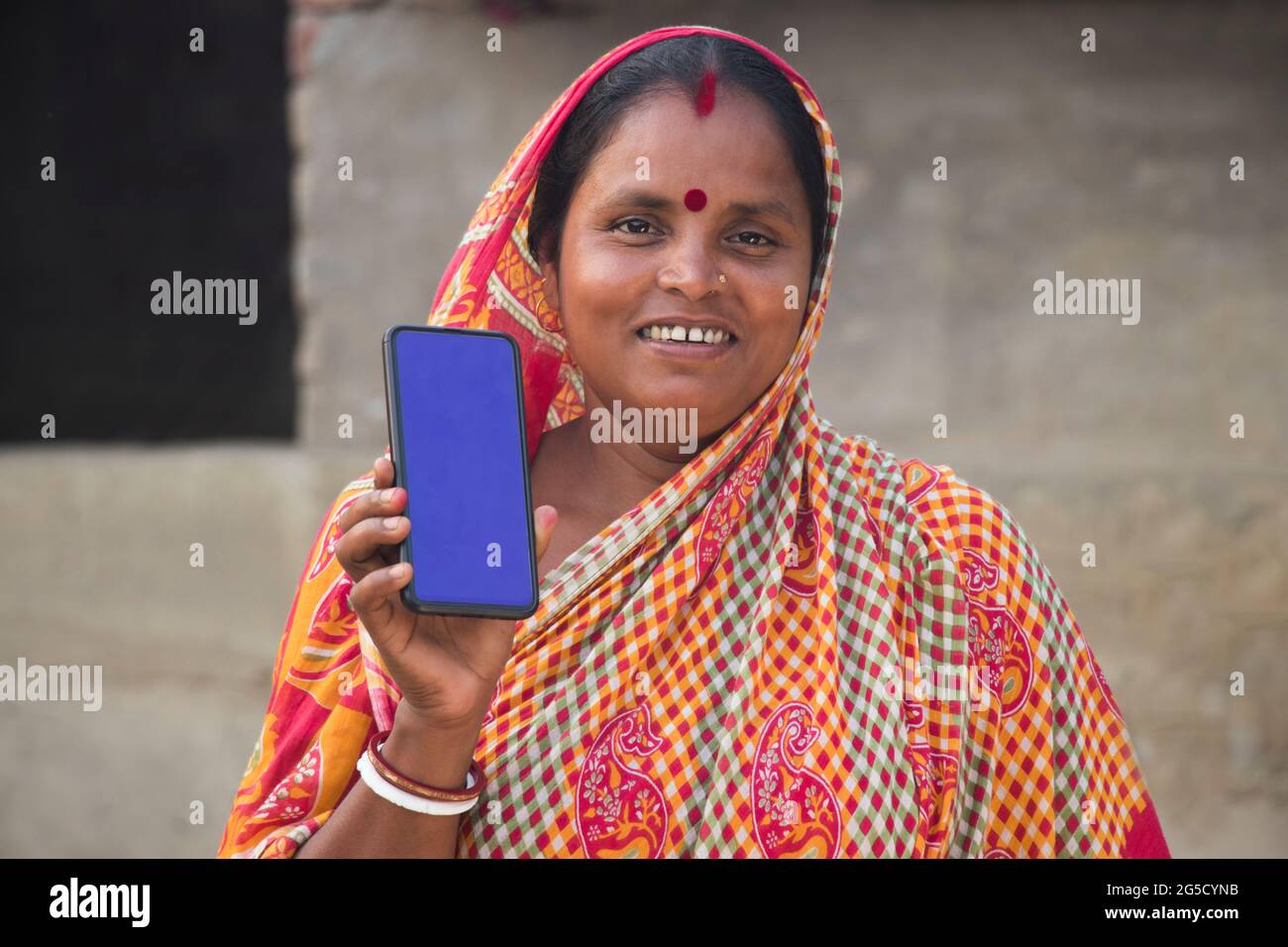 Rural Indian Man Showing on mobile phone Stock Photo - Alamy