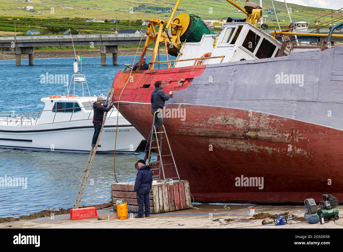 Fishermen painting trawler fishing boat hi-res stock photography and ...