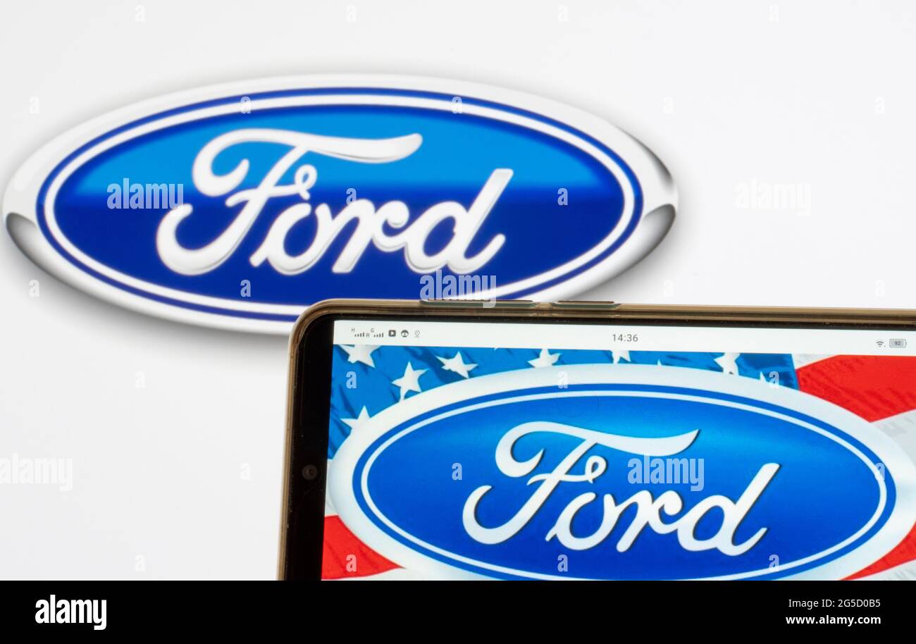 In this photo illustration a Ford Motor Company logo seen displayed on ...