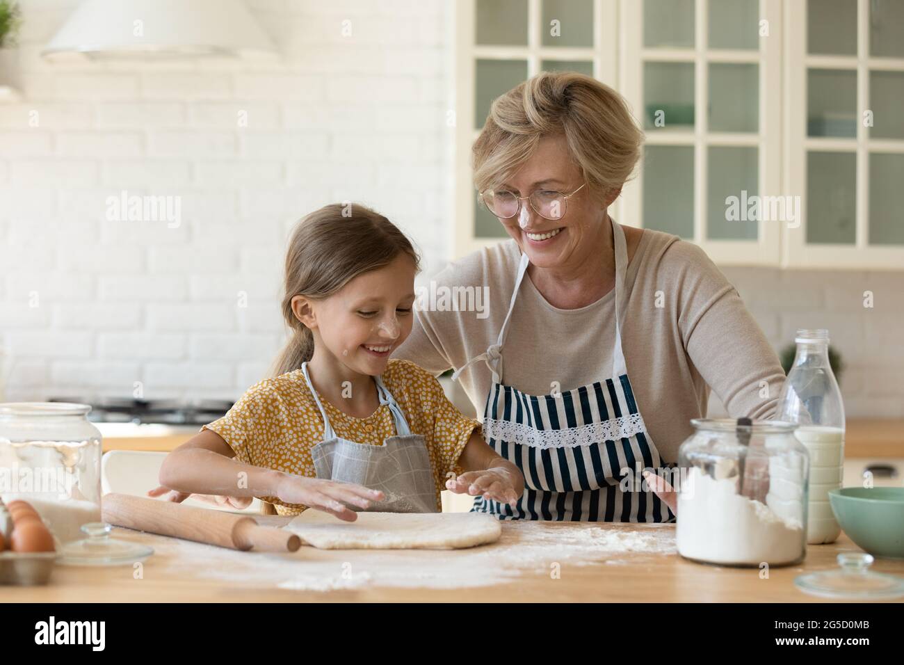 Happy family having fun cooking in kitchen Stock Photo - Alamy