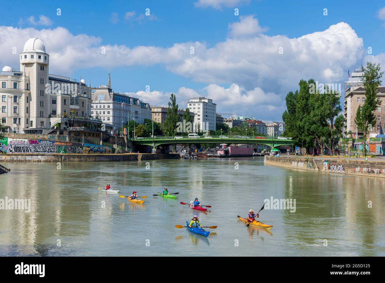 Wien, Vienna: river Donaukanal, paddle boats, paddlers, Urania building ...
