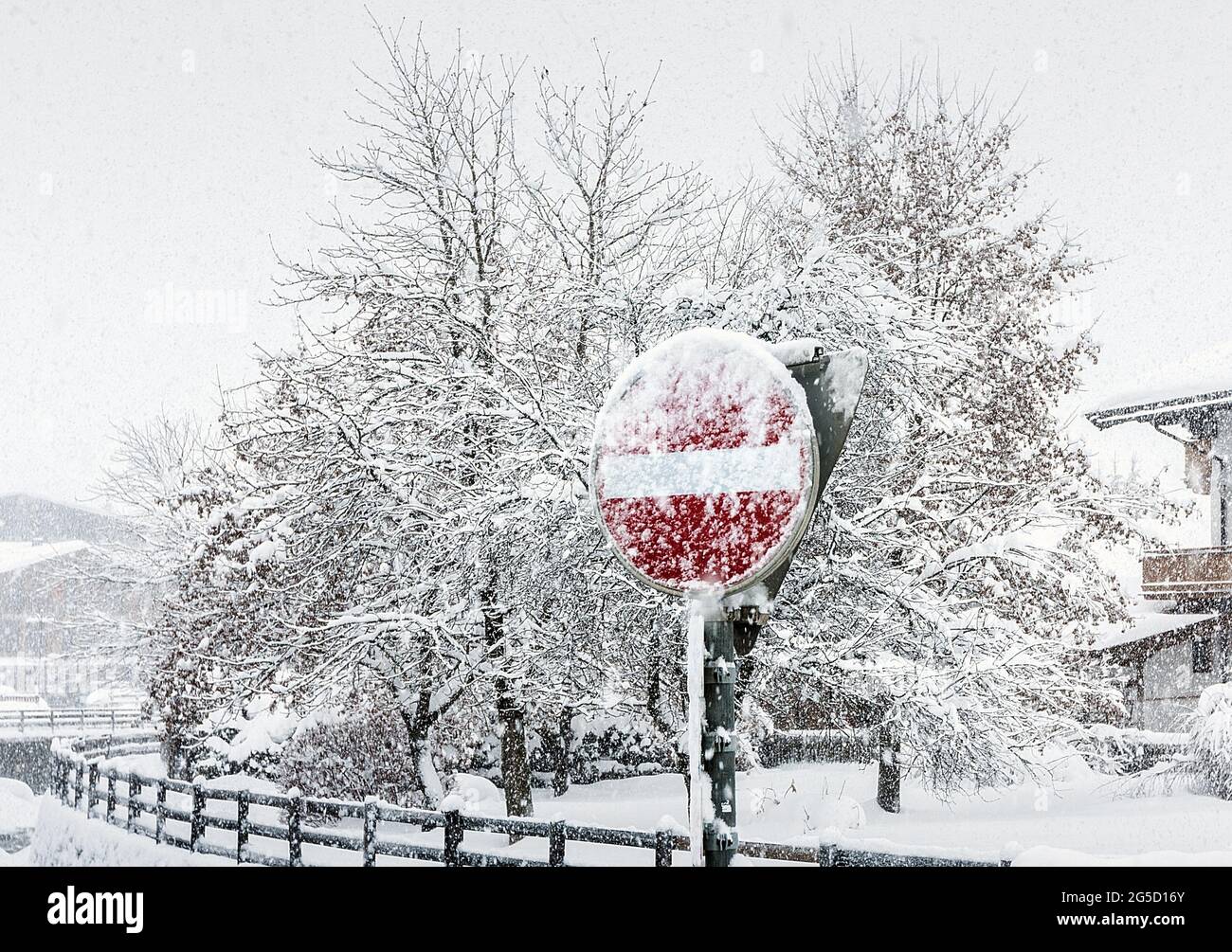 No entry sign, for prohibited traffic. Winter, branches in hoarfrost ...