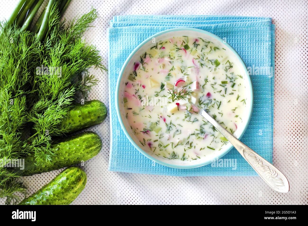Okroshka - traditional Russian cold soup with fresh cucumber, boiled ...