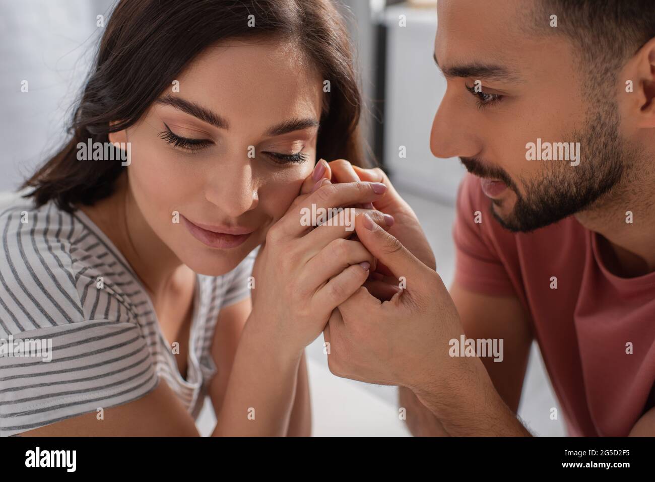 Couple touching hands home close up hi-res stock photography and images ...