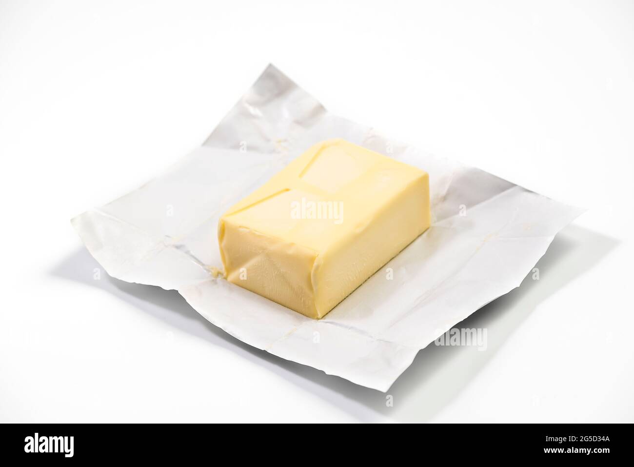 Traditional butter block unwrapped for use as a baking ingredient ...