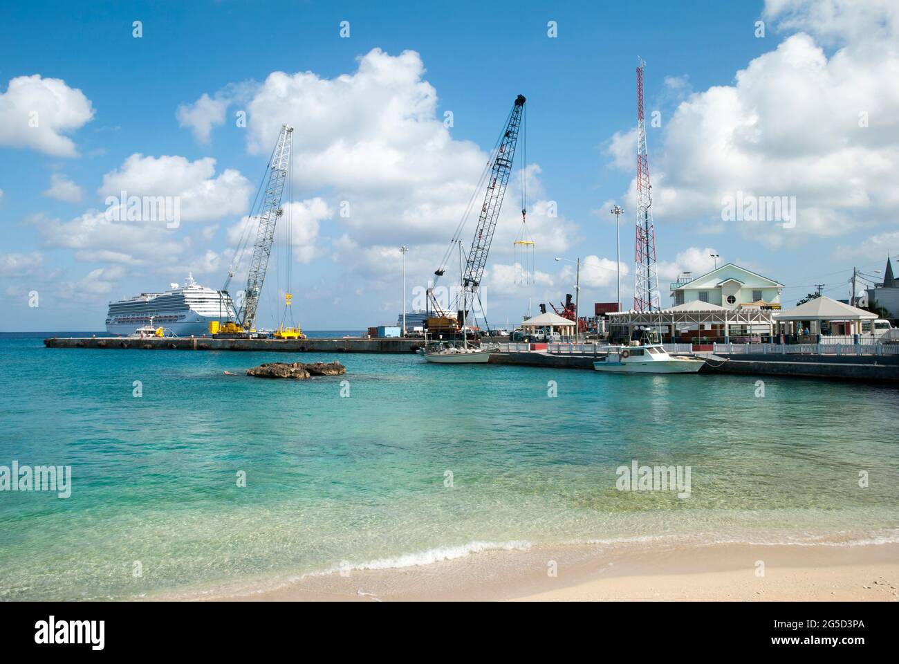 The view of a public beach near George Town port with cruise ships in a ...