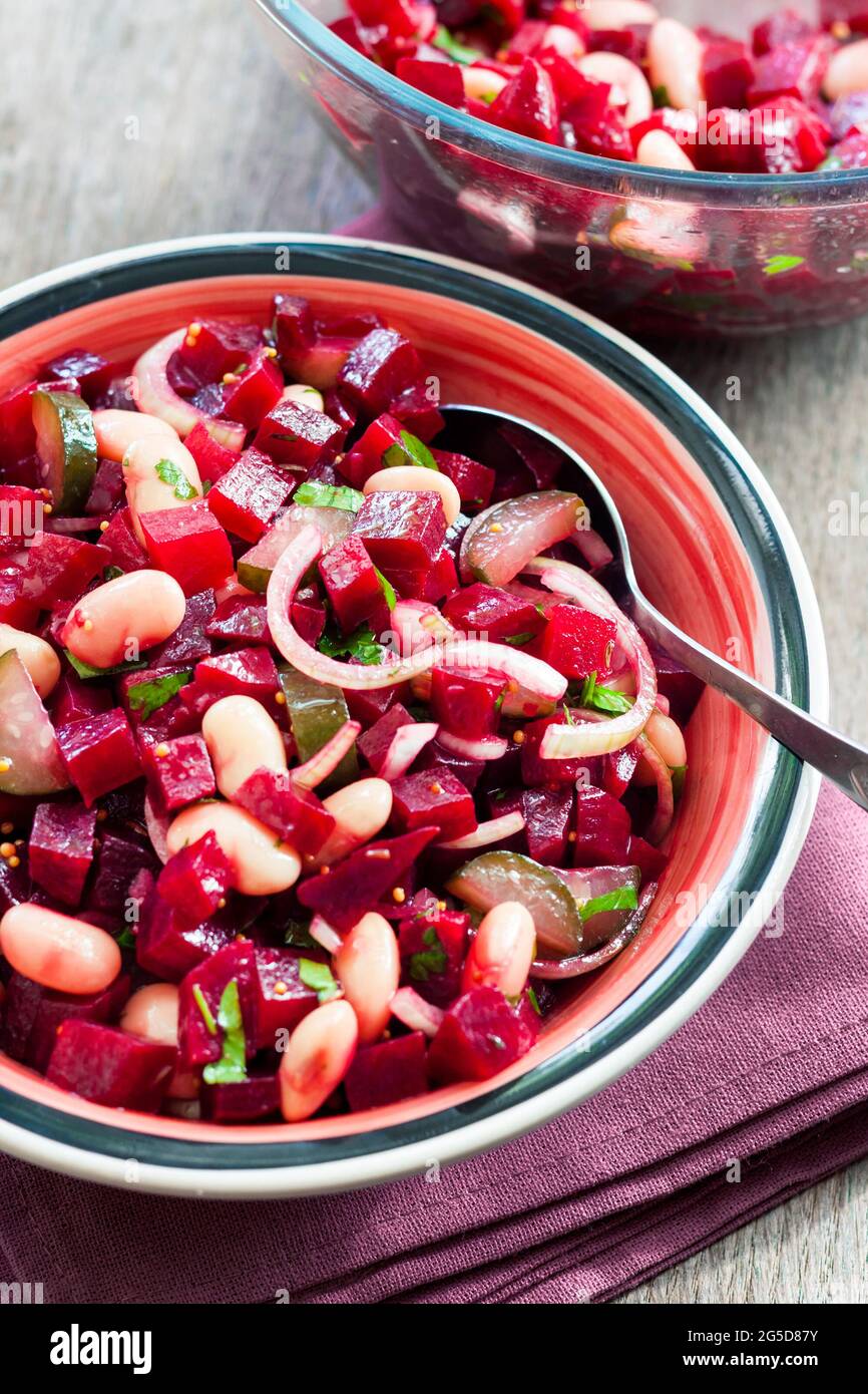 Salad with beetroot, kidney beans and pickles dressed with vinaigrette ...