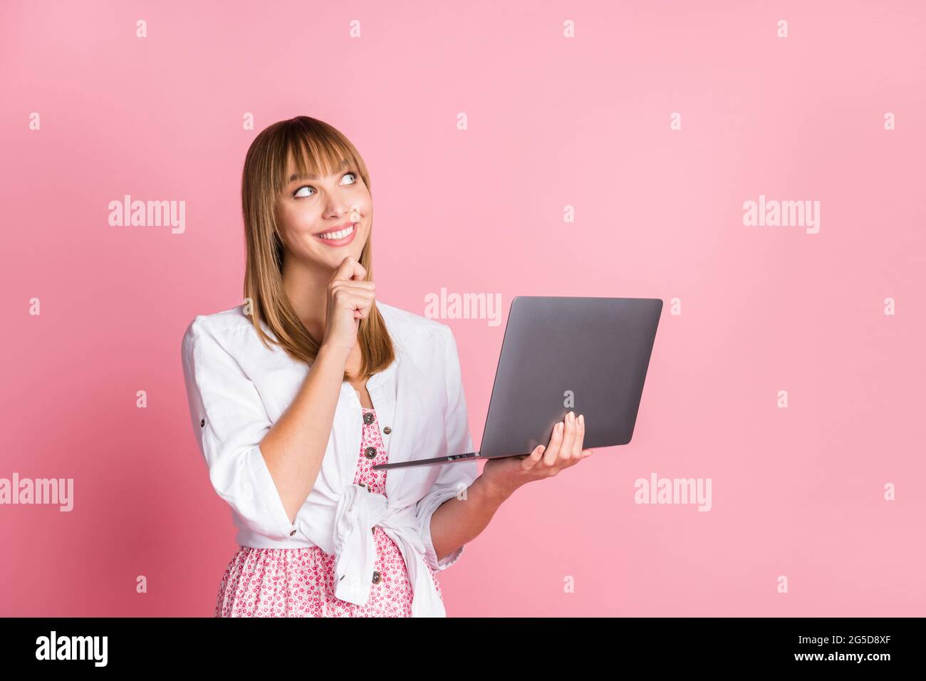 Photo portrait female programmer dreaming looking at copyspace touching ...