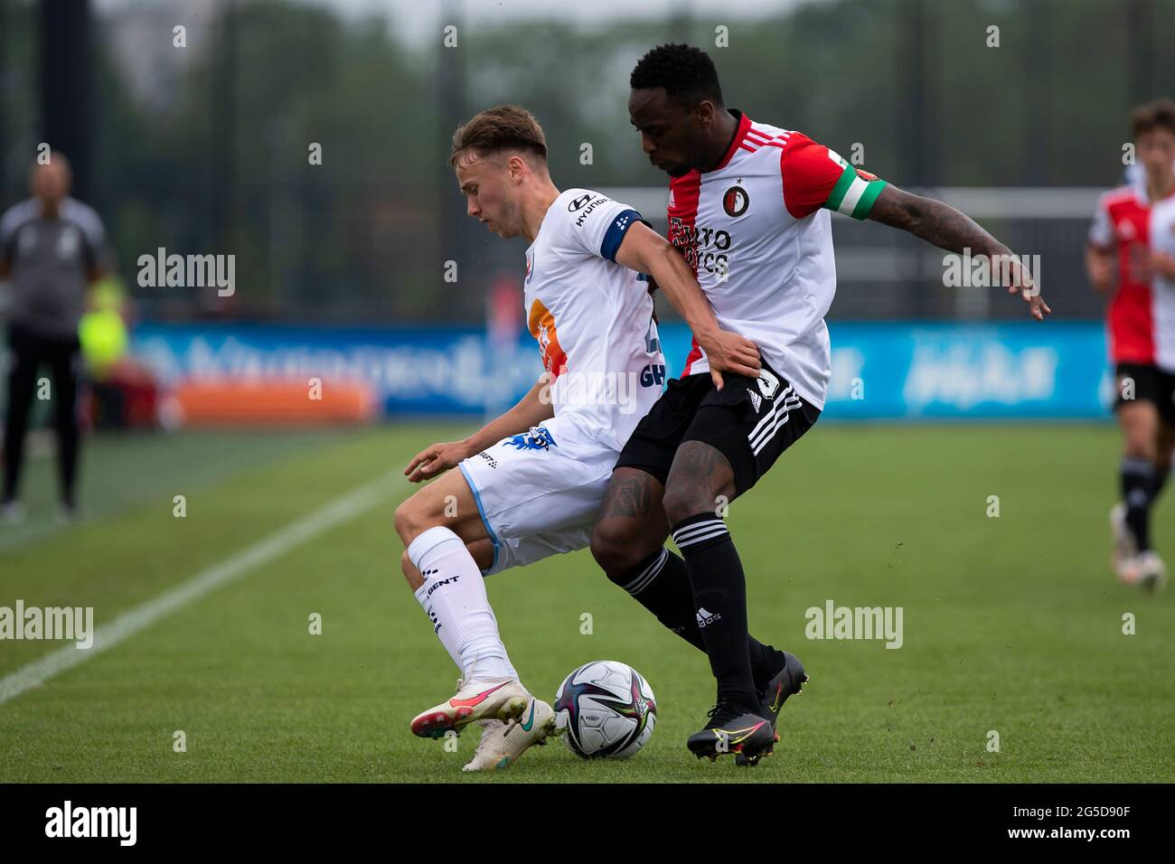 Gent's Wouter George and Feyenoord's Ridgeciano Haps pictured in action ...