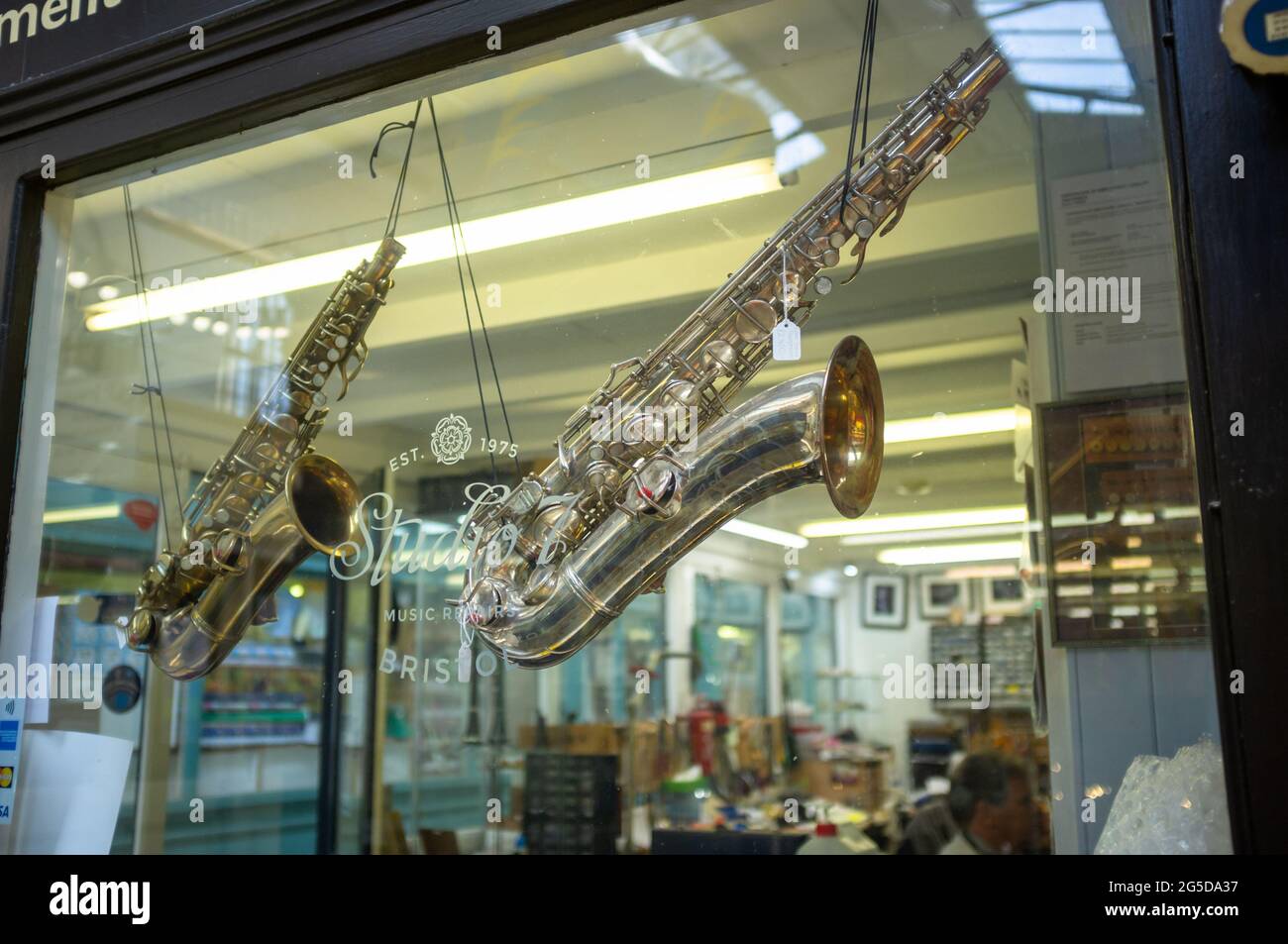 Saxophones on display in a city shop, UK Stock Photo - Alamy
