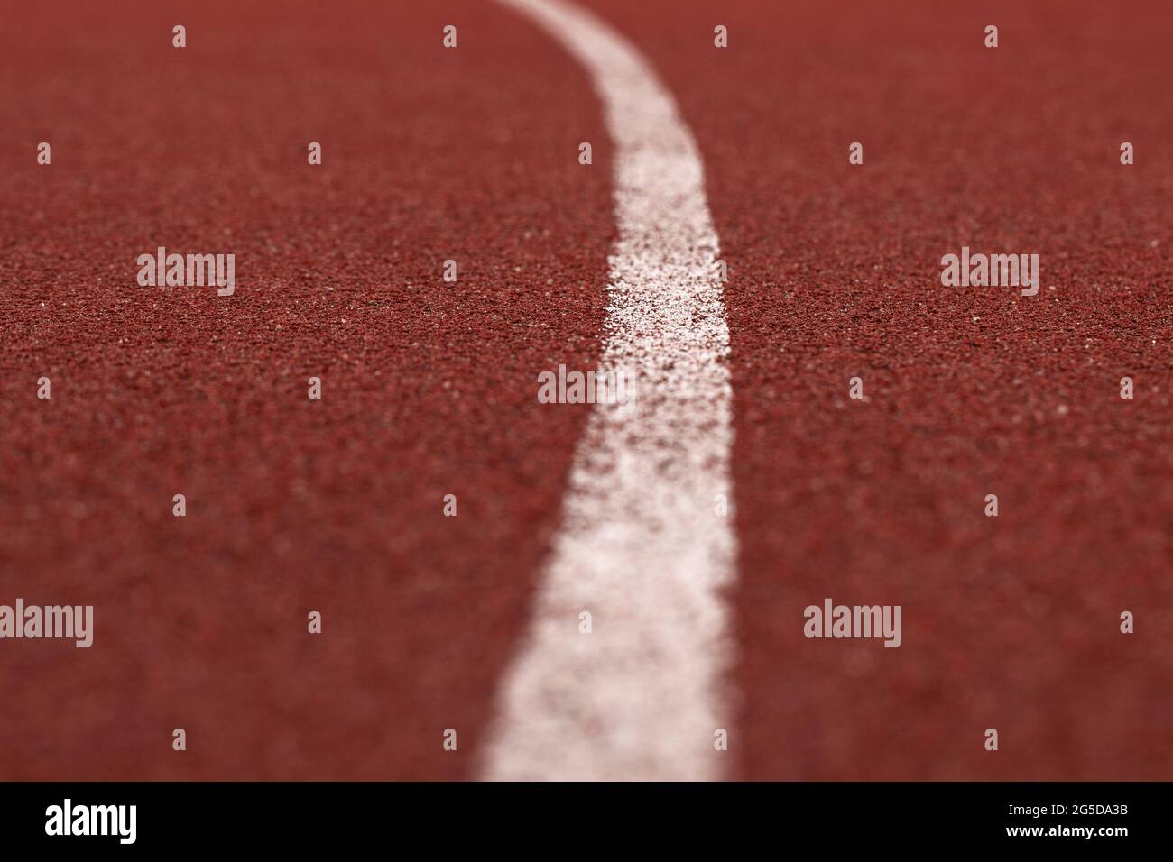 Red racing track with white line rubber texture in stadium texture ...