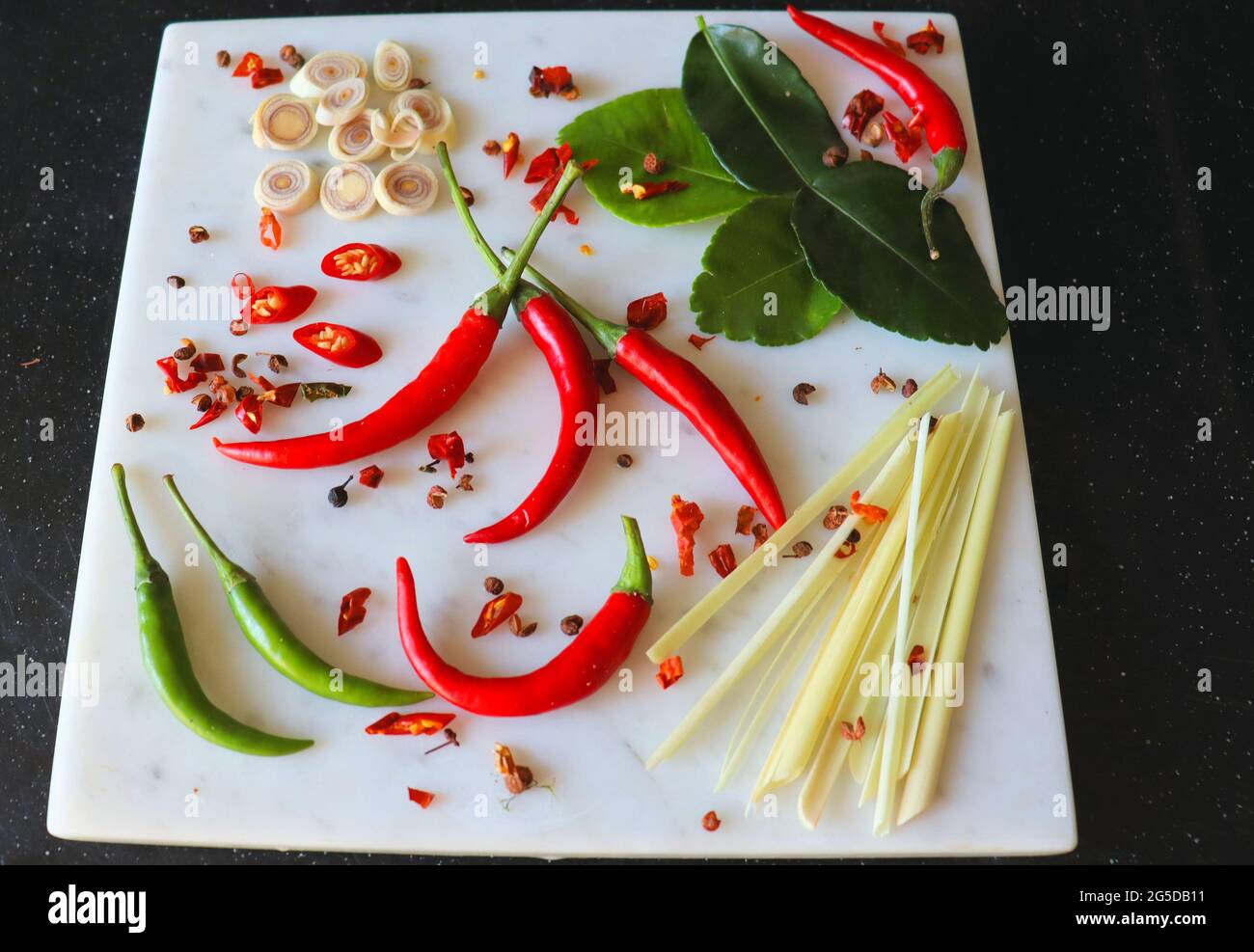 Spices on a marble background, hot peppers, cinnamon and other ...