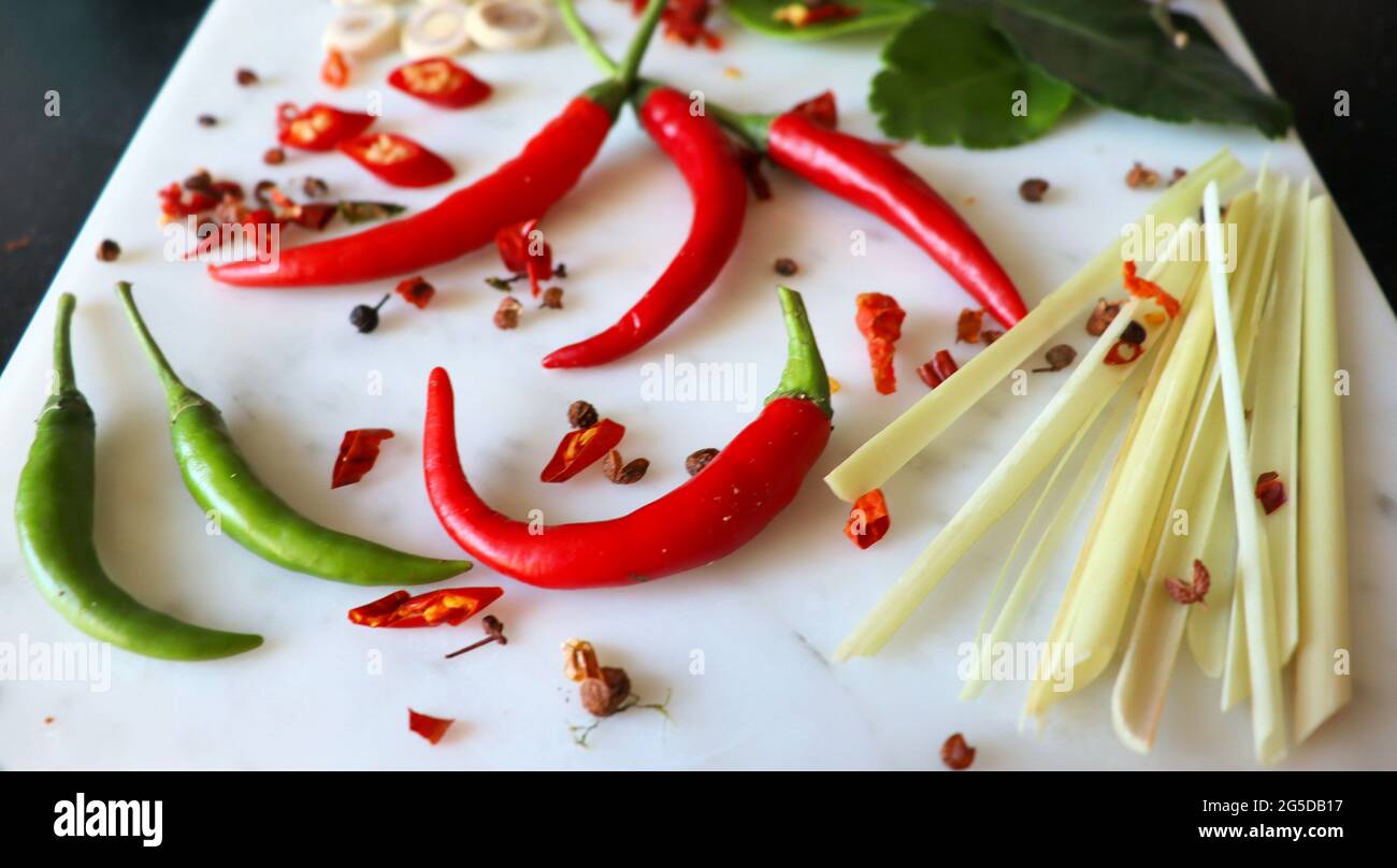 Spices on a marble background, hot peppers, cinnamon and other ...