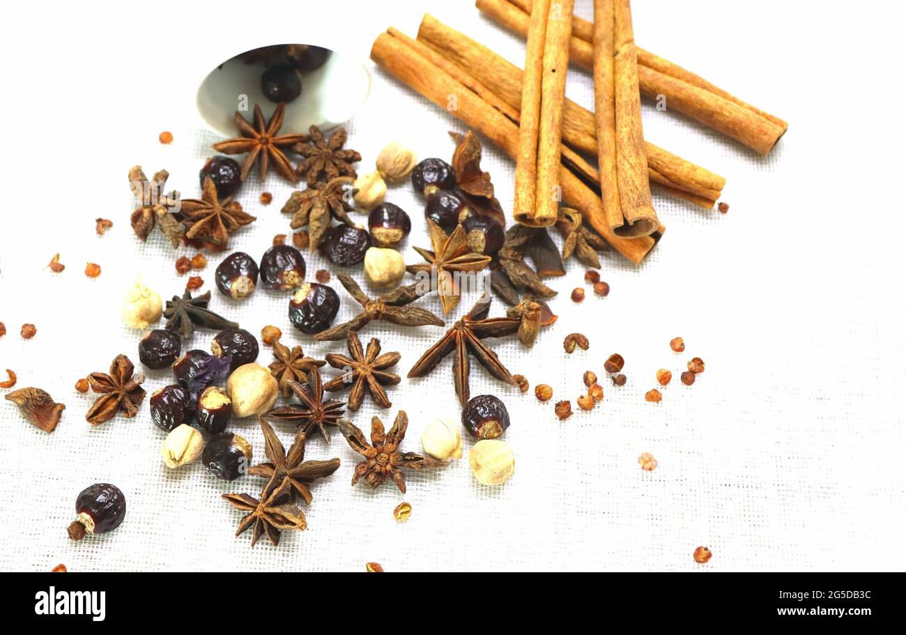 Spices on a marble background, hot peppers, cinnamon and other ...