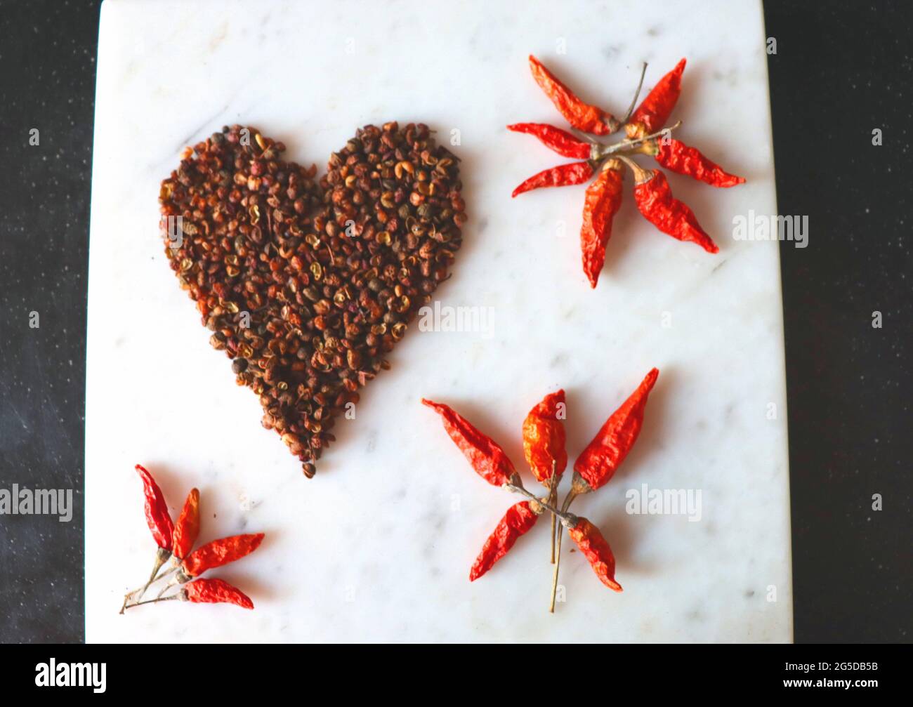 Spices on a marble background, hot peppers, cinnamon and other ...