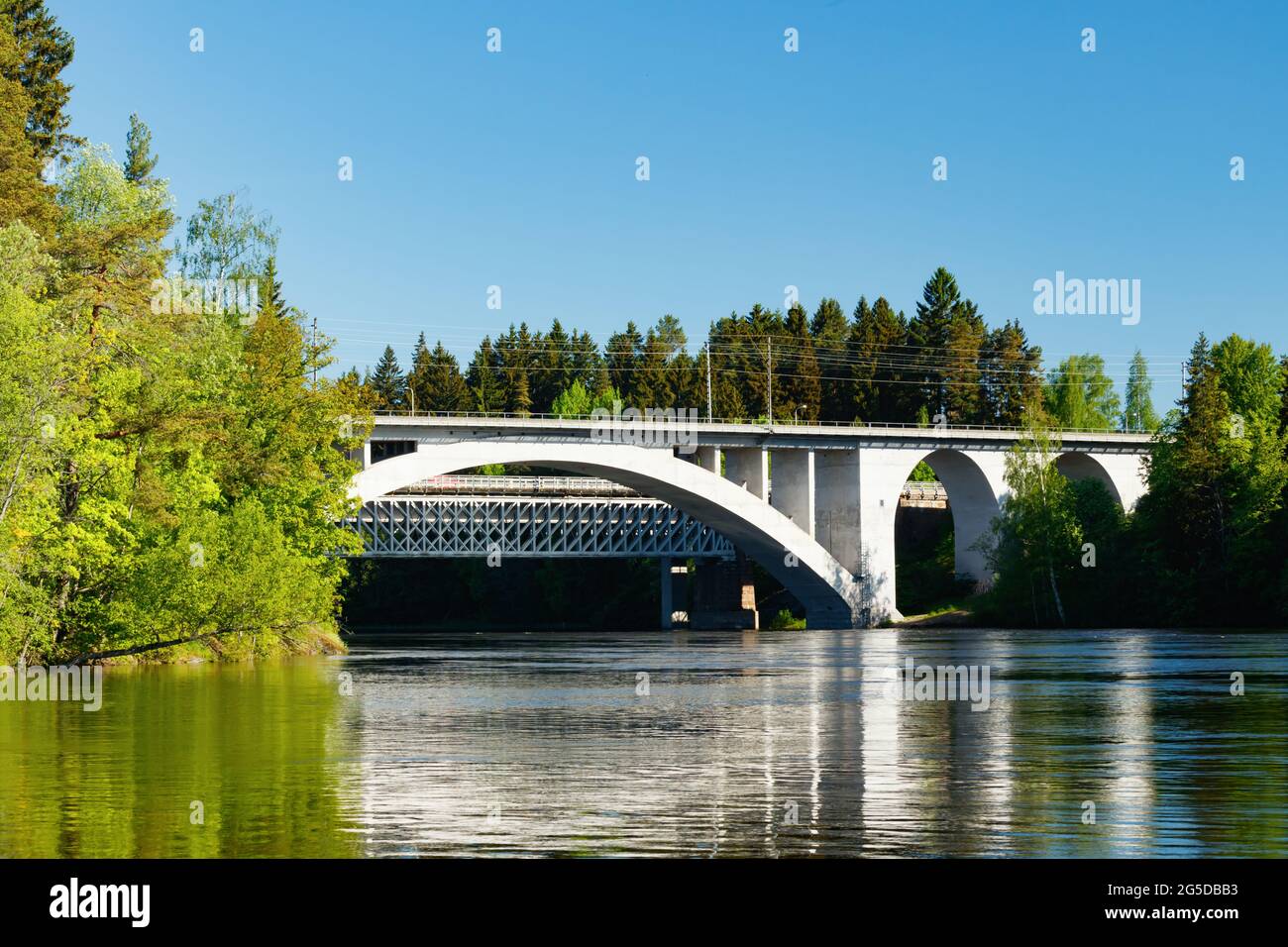 Summer landscape of bridge and Kymijoki river waters in Finland ...