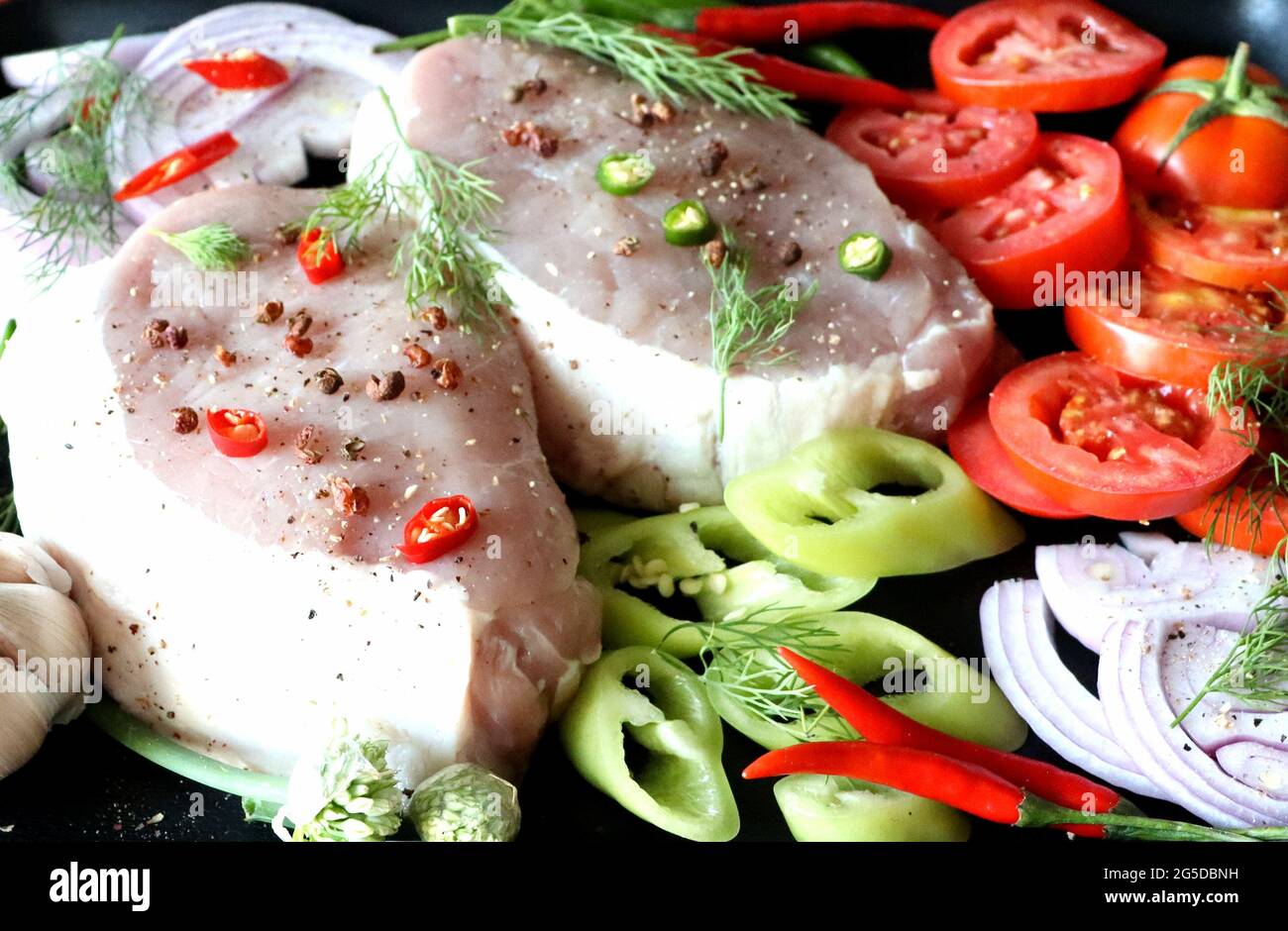 Meat with vegetables and spices, onions, red and green peppers, ginger ...