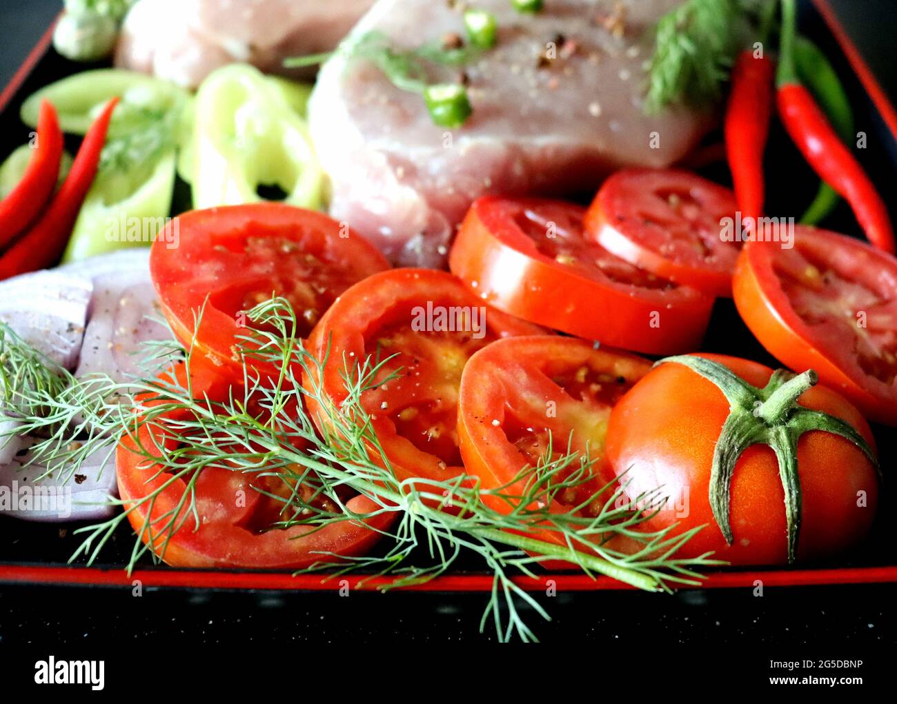 Meat with vegetables and spices, onions, red and green peppers, ginger ...