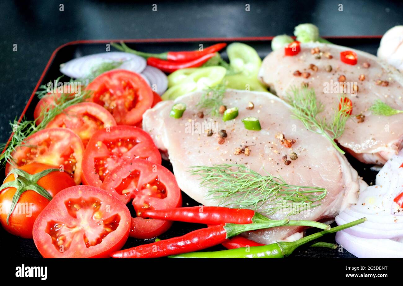 Meat with vegetables and spices, onions, red and green peppers, ginger ...